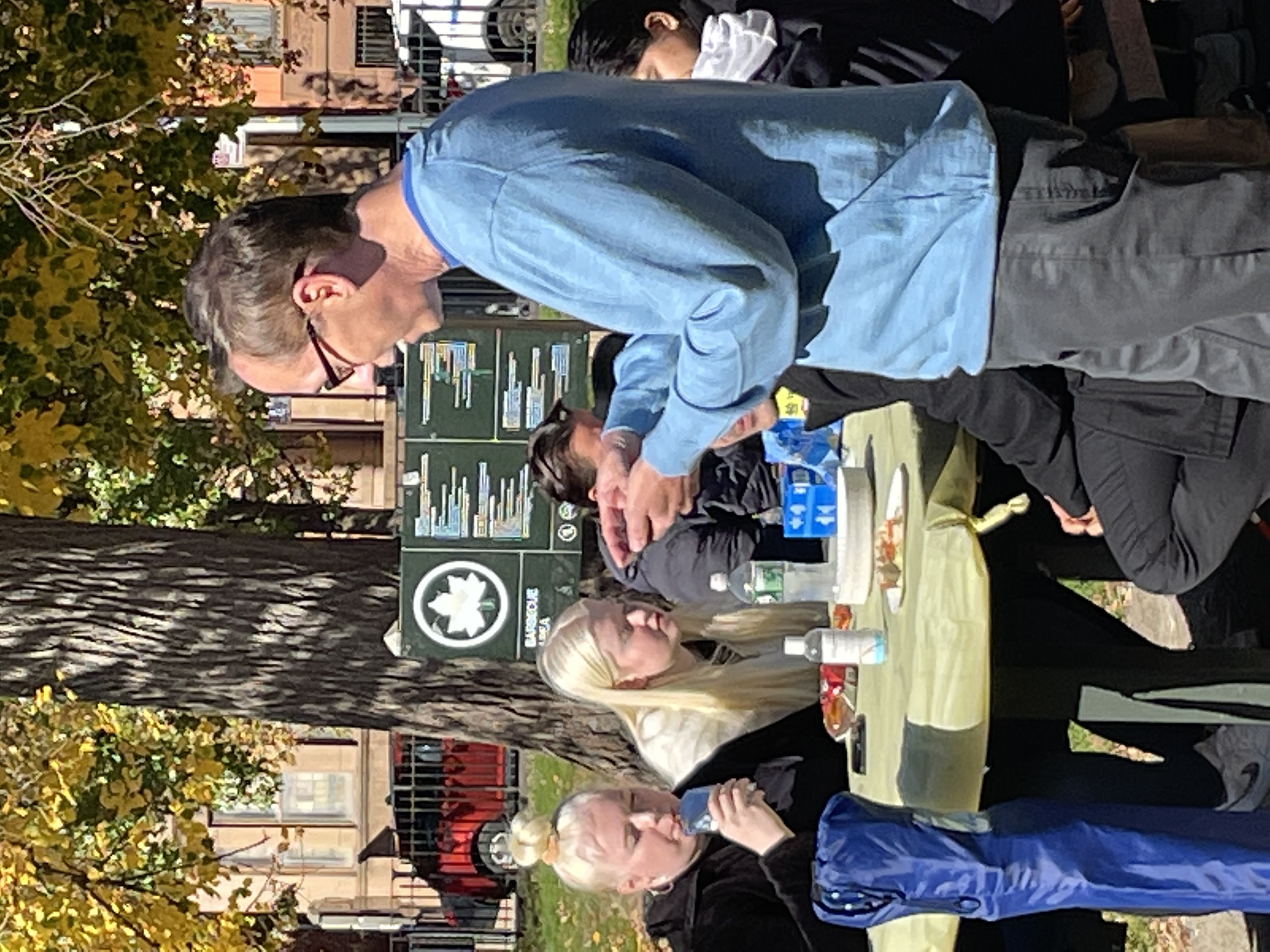 Photo of a man adressing a croud..